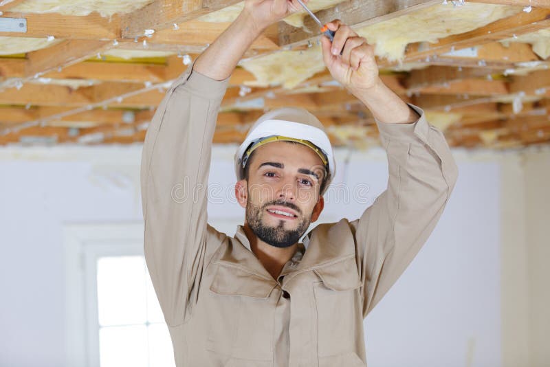 Construction Worker Fixing Ceiling Stock Photo - Image of professional ...