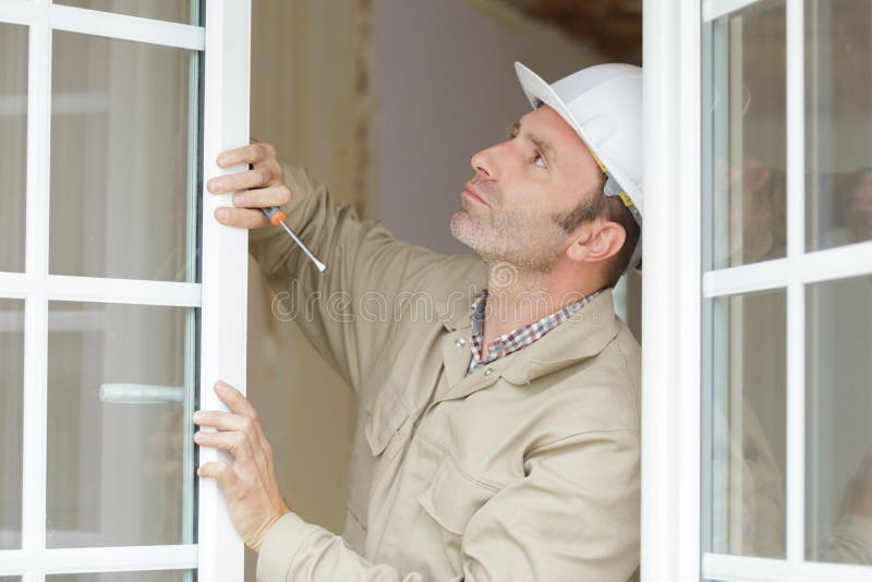 Construction Worker Fixing Window Stock Image - Image of manual ...