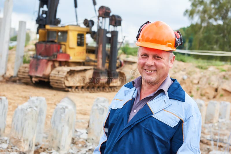 Construction Worker in Front of Pile Driver Machine Stock Photo - Image ...