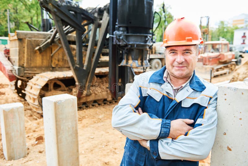 Construction Worker in Front of Pile Driver Machine Stock Photo - Image ...