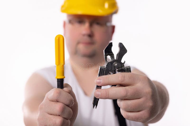 A Construction Worker Grasping Tools Firmly in Their Hands, Ready To ...
