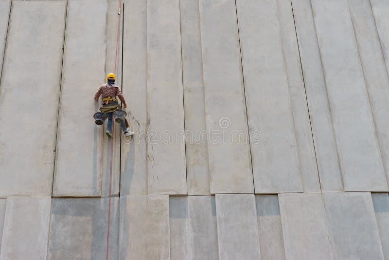 Construction Worker and Grey Cement Wall Editorial Photography - Image ...