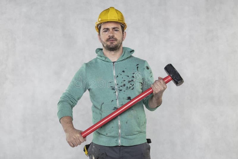 Construction Worker with a Hammer in Hand, Concept of Construction and ...