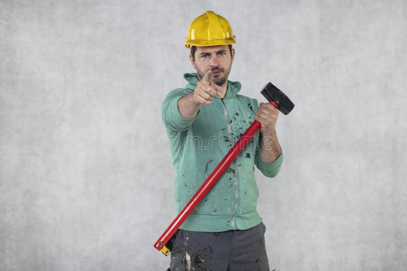 Construction Worker with a Hammer in Hand, Concept of Construction and ...