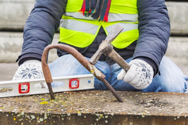 Construction Worker with Hammer Near Concrete Blocks Stock Image ...