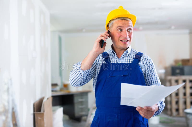 Construction Worker Having Telephone Conversation Stock Photo - Image ...