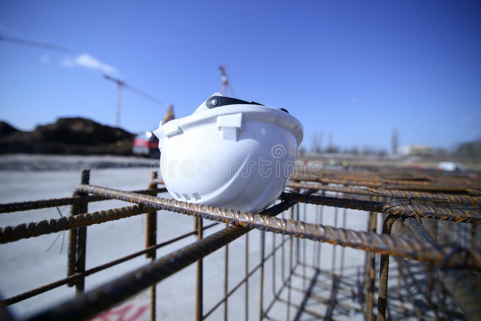 Construction Worker Helmet on Top of a Reinforcing Iron Stock Photo ...