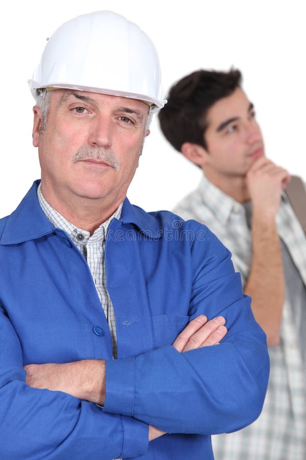 Construction Worker and His Trainee. Stock Photo - Image of pensive ...