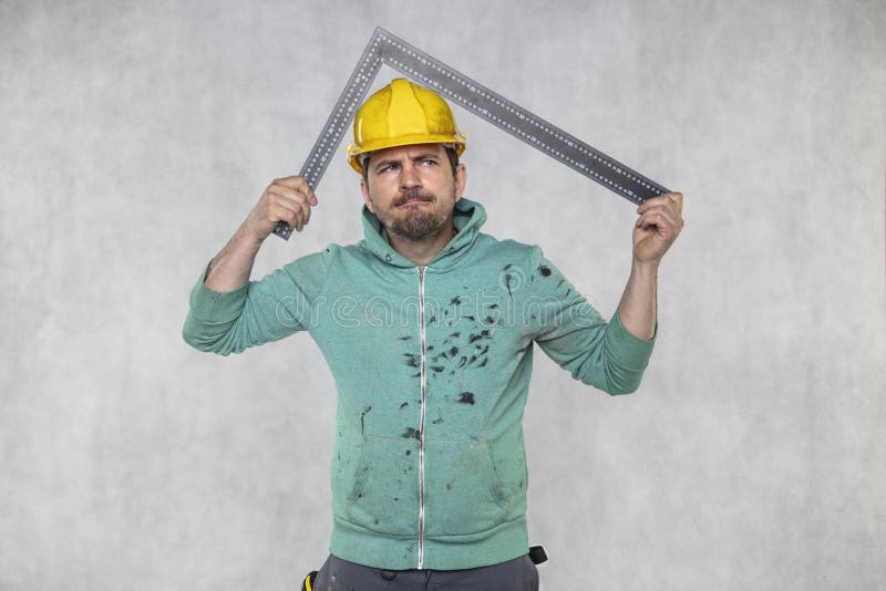 The Construction Worker is Holding a Angle in the Hand, a Guide To ...