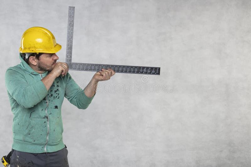 The Construction Worker is Holding a Angle in the Hand, a Guide To ...