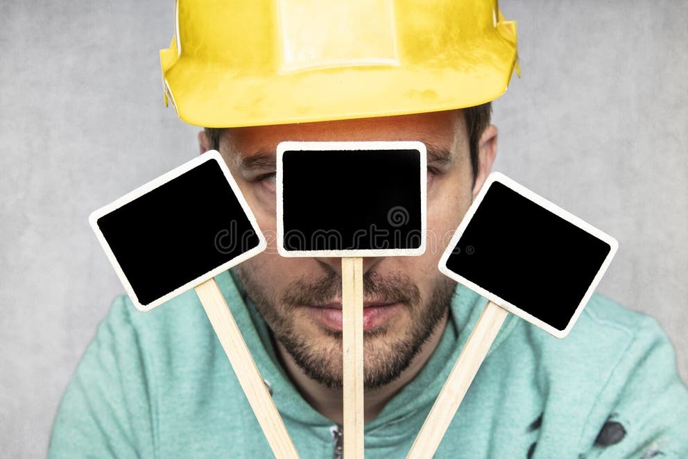 Construction Worker Holding a Blackboard with Space for Text or Text ...