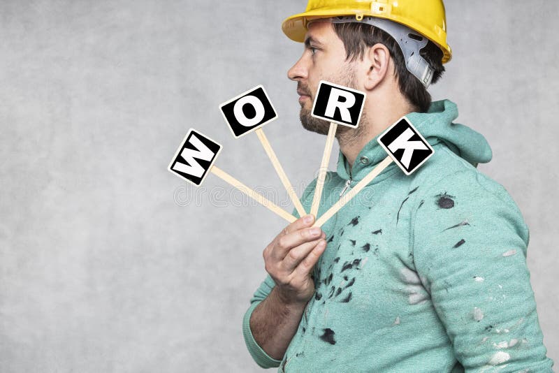 Construction Worker Holding a Blackboard with Space for Text or Text ...