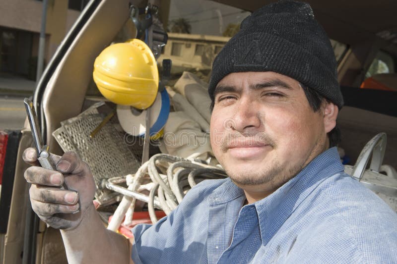 Construction Worker Holding Cell Phone Stock Image - Image of ...