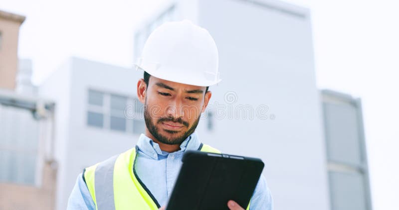 Construction Worker Holding a Digital Tablet while Doing Inspection ...