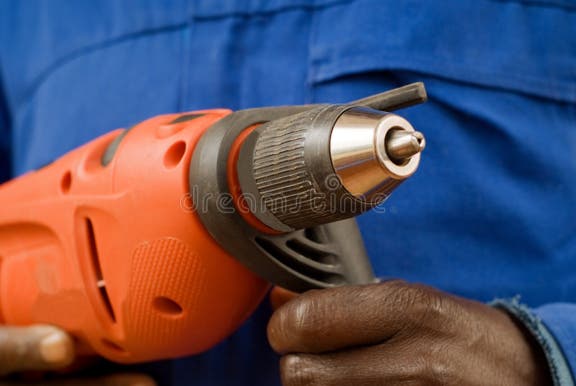 Construction Worker Holding a Power Tool Stock Photo - Image of ...