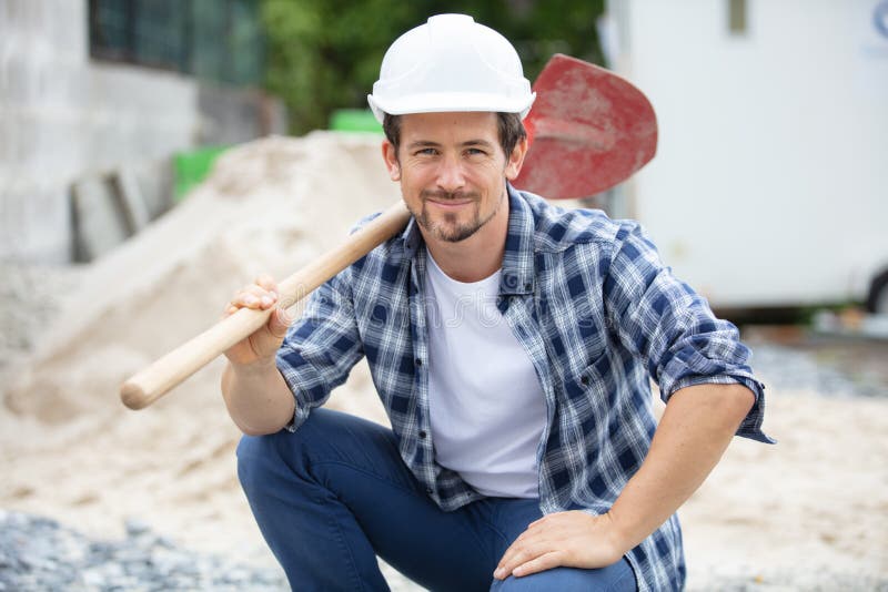 Construction Worker Holding Shovel Stock Photo - Image of clothing ...