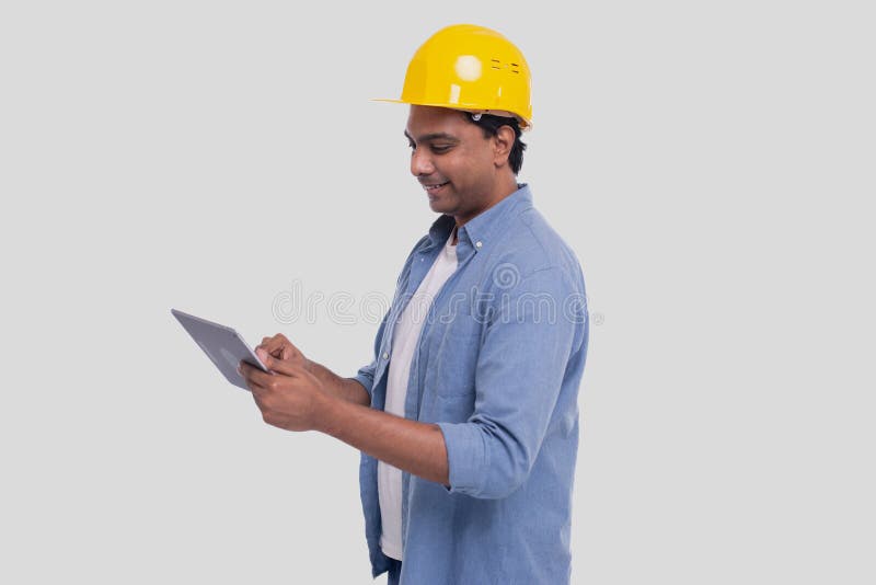 Construction Worker Holding Tablet in Hands. Man Using Tablet ...