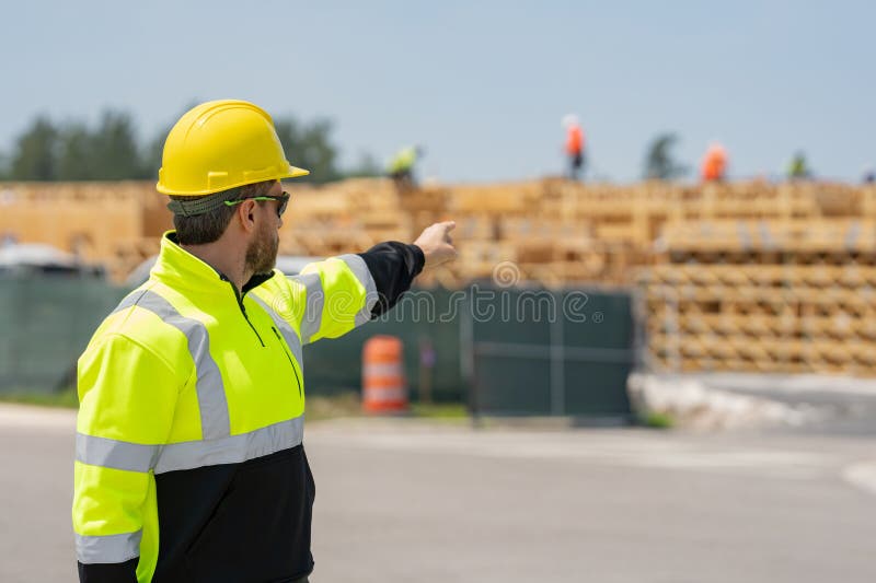 Construction Worker at House Under Construction. Male Builder ...