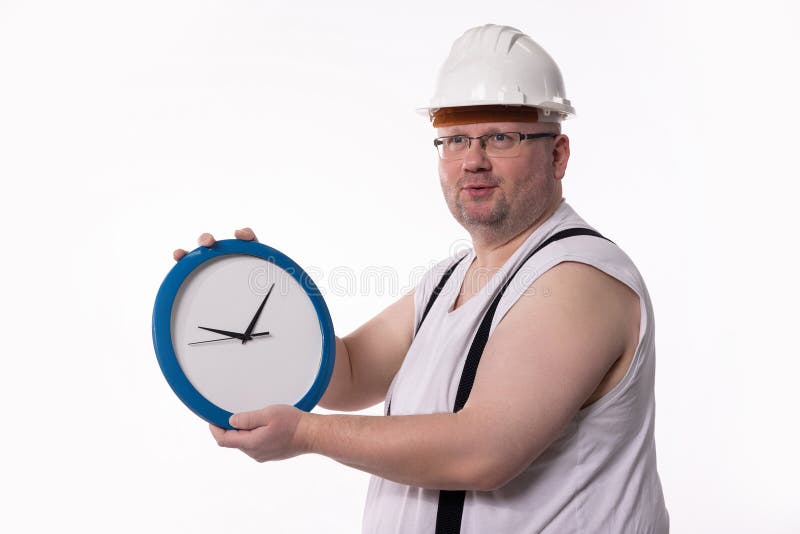 A Construction Worker Humorously Posing while Holding a Clock ...