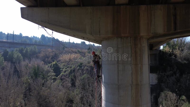 Technician Working at Height on Bridge Pillar Stock Video - Video of ...