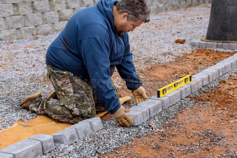 Construction Worker Installing Arranging Precast Concrete Pavers Stone ...