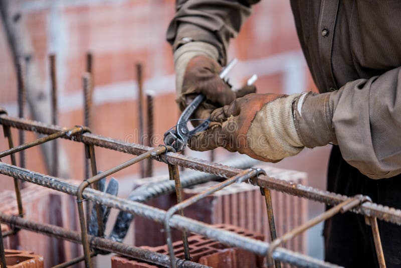 Construction Worker Installing Binding Wires on the Reinforcement Stock ...