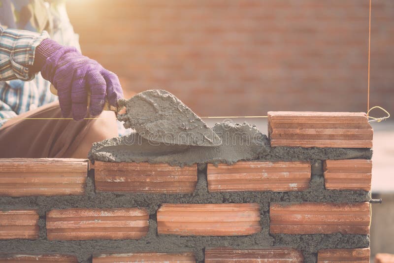 Worker Installing Bricks Wall in Process of House Building Stock Photo ...