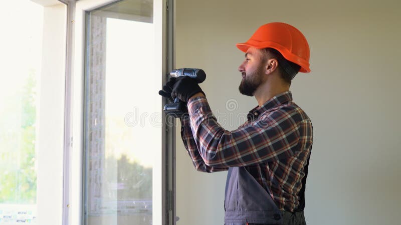 Construction Worker Installing and Checking Pvc Window or Door in the ...