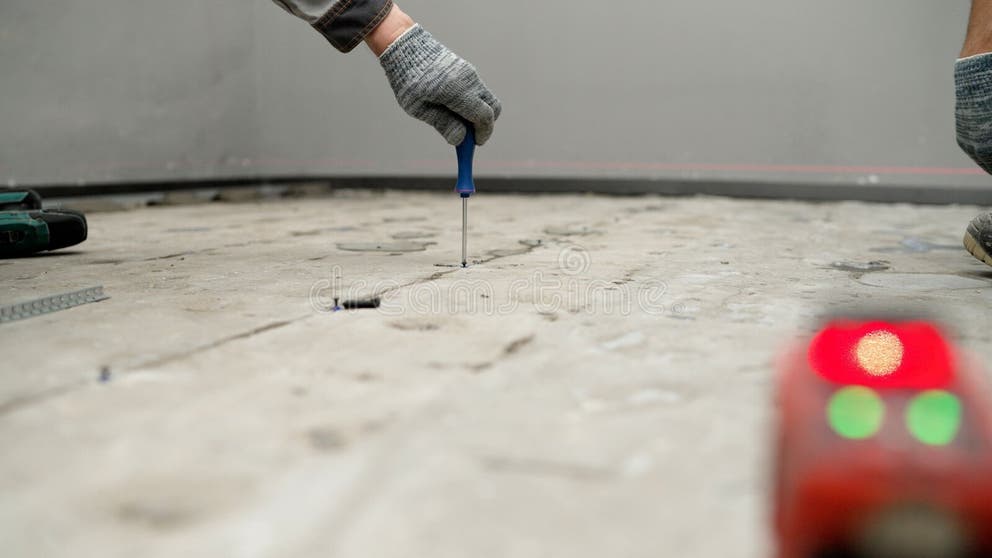 Construction Worker Installing Metal Beacons Using Laser Level Stock ...