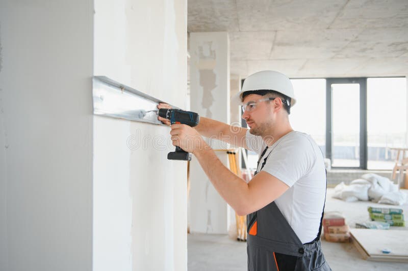 Construction Worker Installing Metal Profile for Interior Partition ...