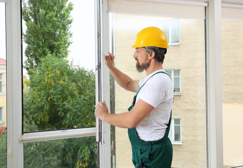 Construction Worker Installing New Window Stock Photo - Image of office ...