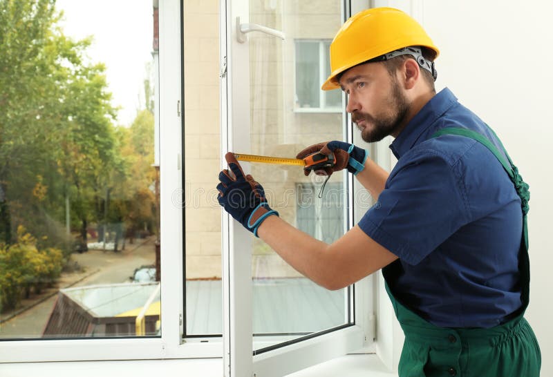 Construction Worker Installing New Window Stock Photo - Image of ...