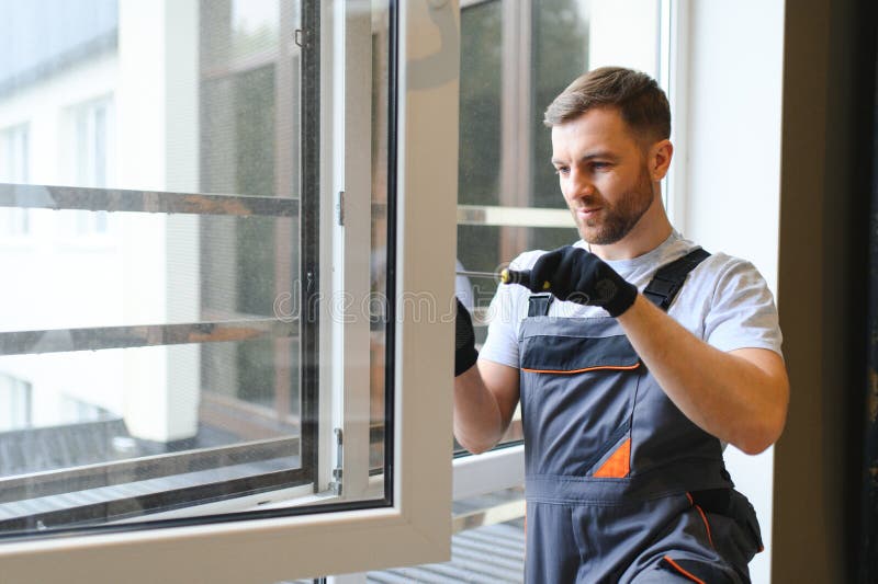 Construction Worker Installing New Window in House Stock Photo - Image ...
