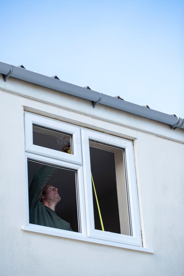 Construction Worker Installing New Windows in House Stock Image - Image ...