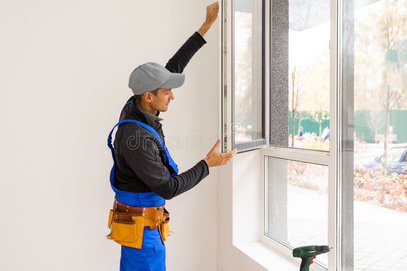 Construction Worker Installing New Windows in House Stock Photo - Image ...