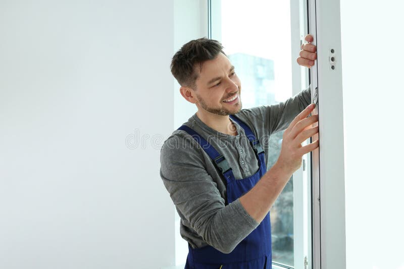 Construction Worker Installing Plastic Window Stock Photo - Image of ...