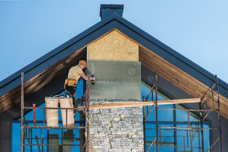 Construction Worker Installing Stone Veneer on a Modern Home Stock ...