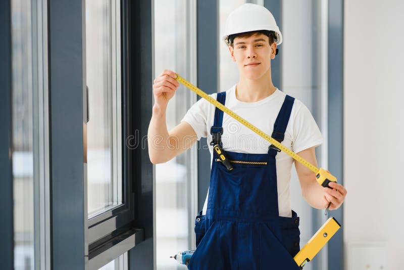 Construction Worker Installing Window in House Stock Photo - Image of ...
