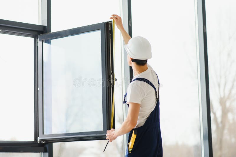 Construction Worker Installing Window in House Stock Photo - Image of ...