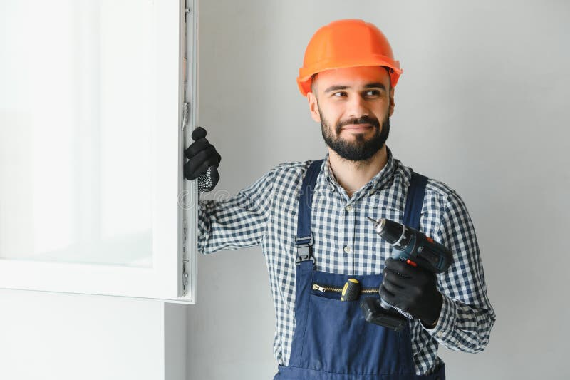Construction Worker Installing Window in House Stock Photo - Image of ...