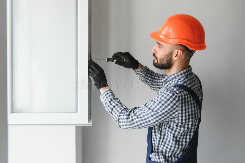 Construction Worker Installing Window in House Stock Photo - Image of ...