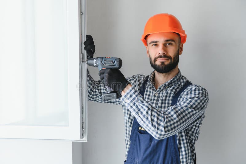 Construction Worker Installing Window in House Stock Image - Image of ...