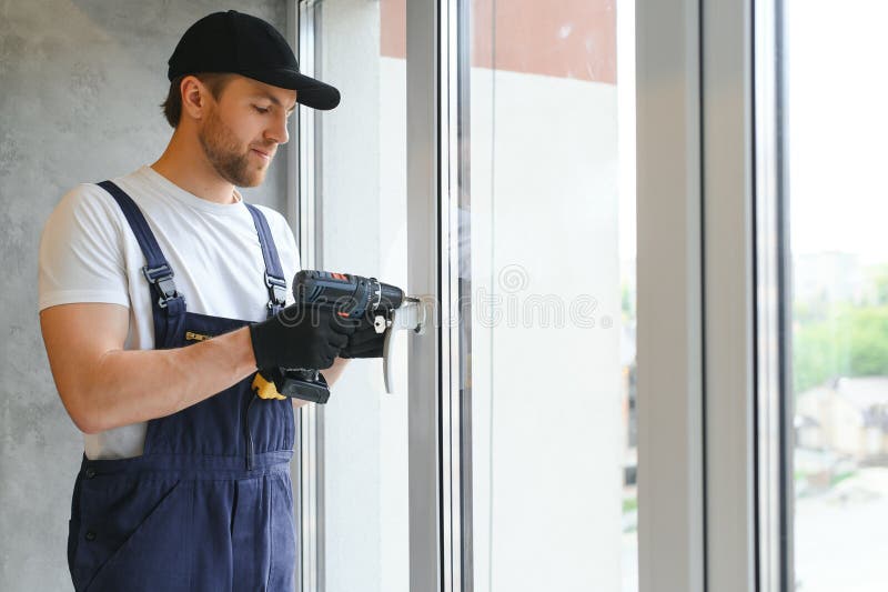 Construction Worker Installing Window in House Stock Photo - Image of ...