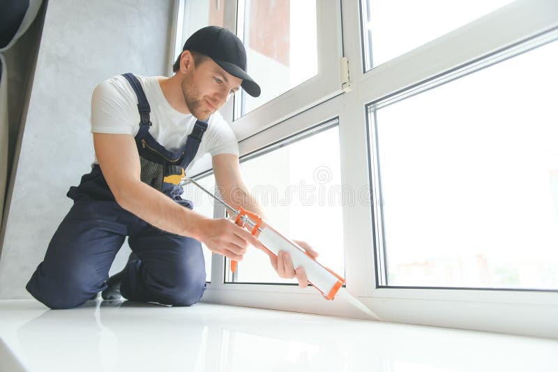 Construction Worker Installing Window in House Stock Image - Image of ...