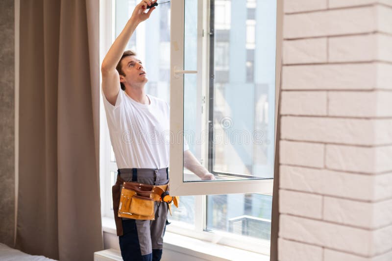 Construction Worker Installing Window in House Stock Photo - Image of ...