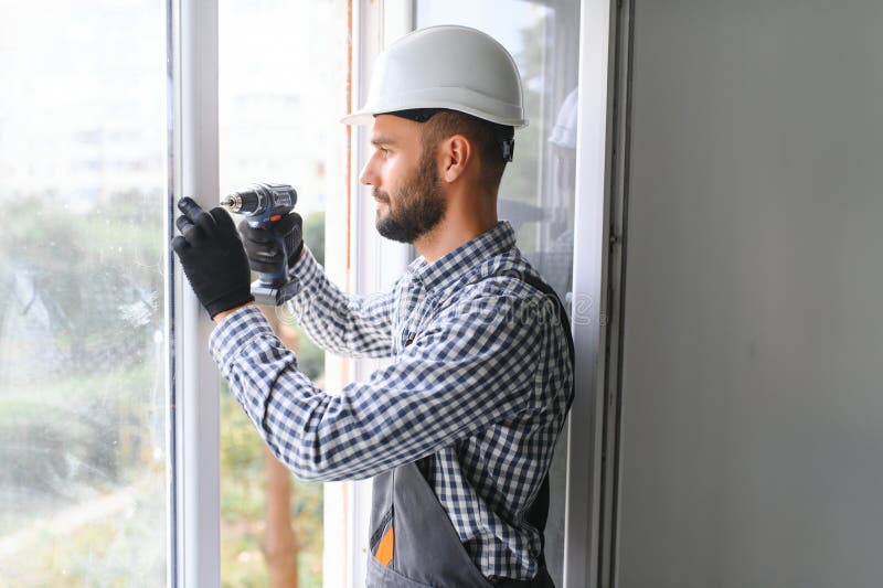 Construction Worker Installing Window in House. Stock Image - Image of ...