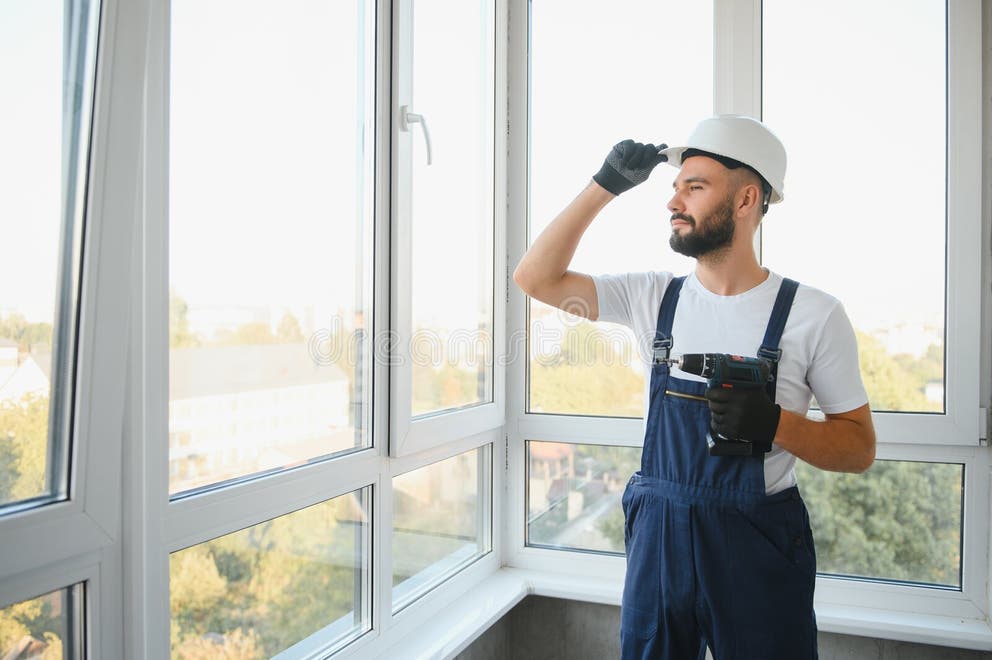 Construction Worker Installing Window in House Stock Image - Image of ...