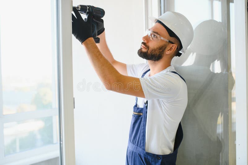 Construction Worker Installing Window in House Stock Photo - Image of ...