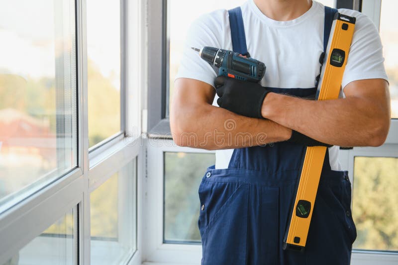 Construction Worker Installing Window in House Stock Photo - Image of ...