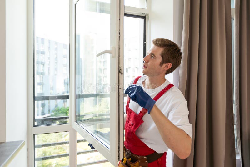 Construction Worker Installing Window in House Stock Photo - Image of ...